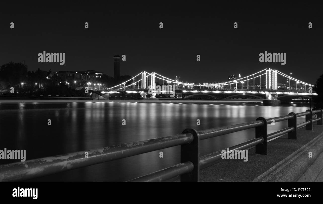 Night London bridge with bright lights and beautiful reflections in ...