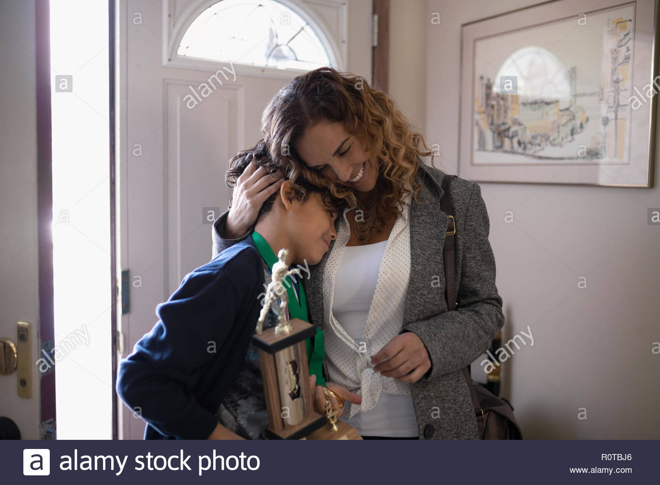 Boy holding up a trophy hi-res stock photography and images - Alamy