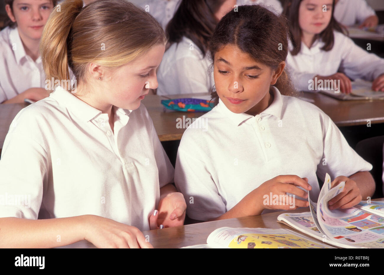 two high school girls in classroom Stock Photo - Alamy