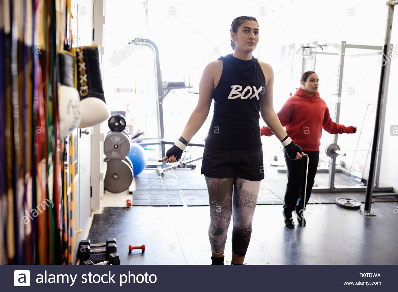Female boxers jumping rope in gym Stock Photo - Alamy