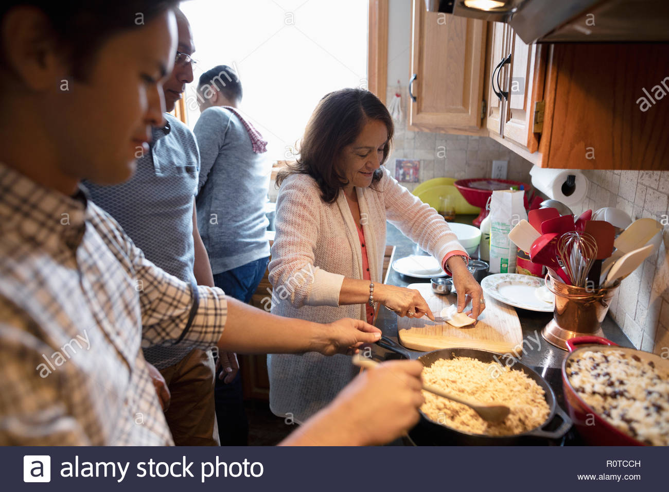 Real latino family kitchen cooking hi-res stock photography and images ...