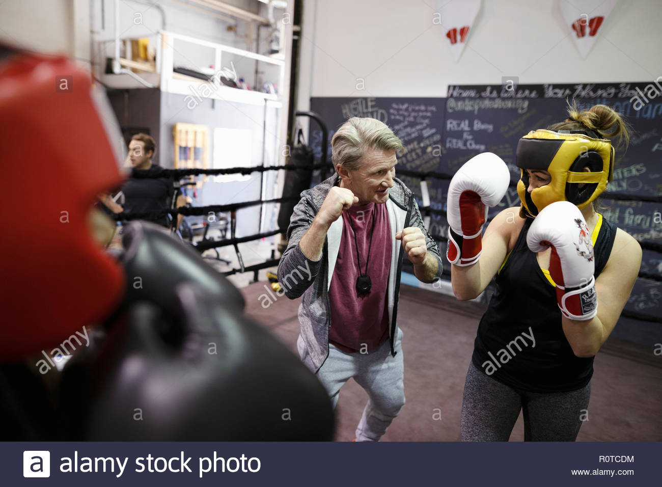 Boxer Training Coach In Ring Stock Photos & Boxer Training Coach In ...