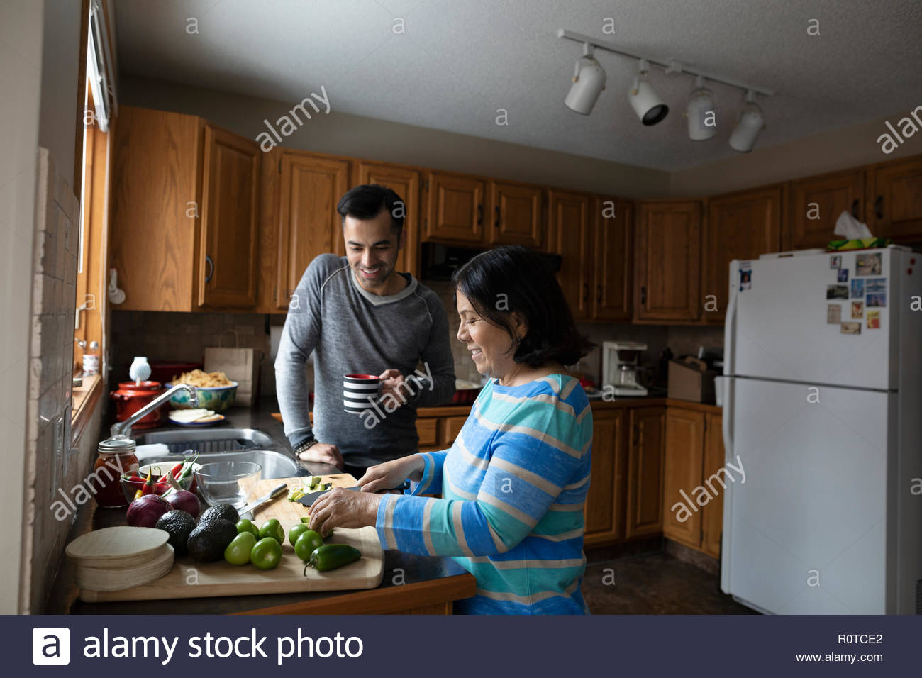 Real latino family kitchen cooking hi-res stock photography and images ...