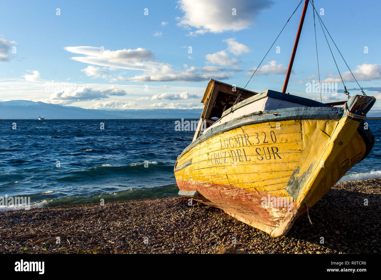 yellow wood fisherman's boat stranded at Chile Chilo beach of Playa ...