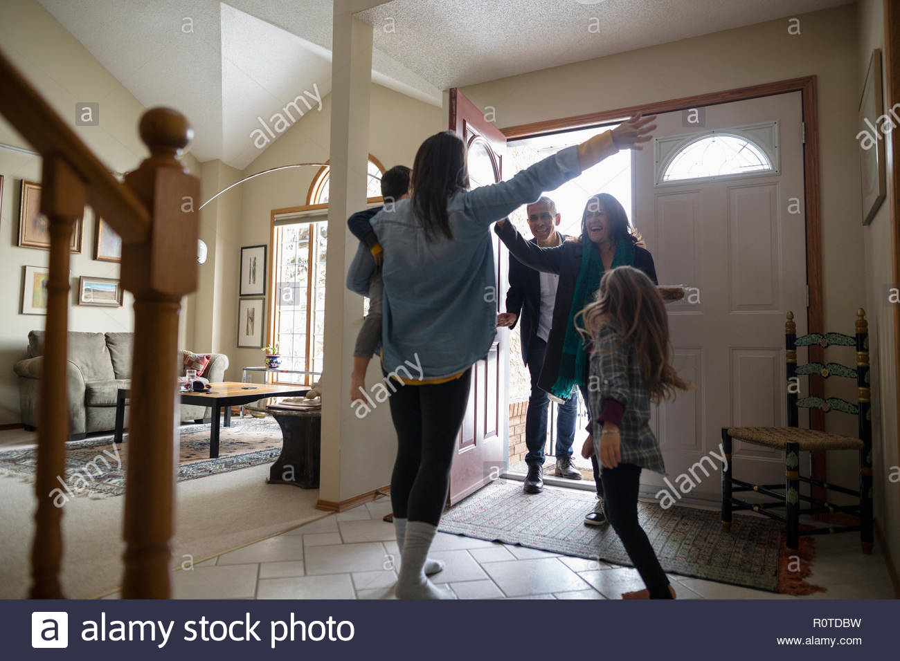 Smiling grandparents visiting family hi-res stock photography and ...