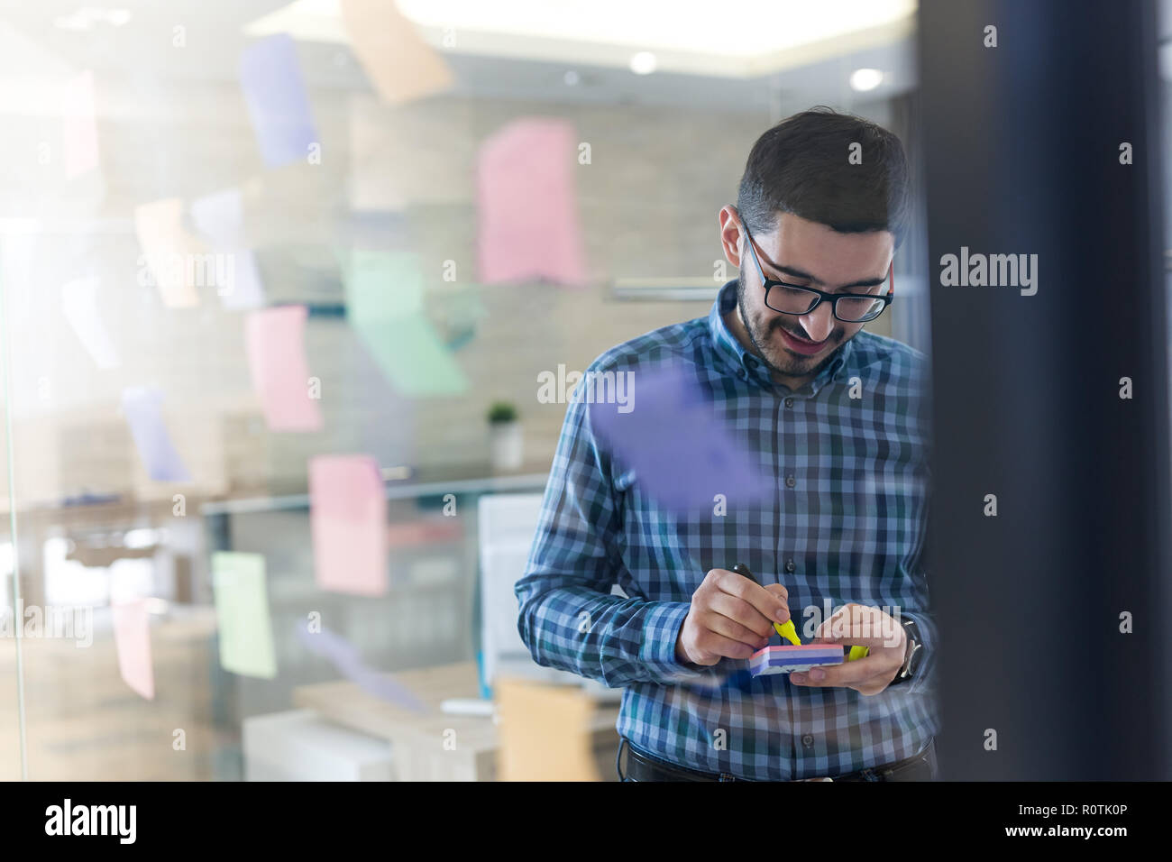 Business people meeting at office and use post it notes to share idea ...