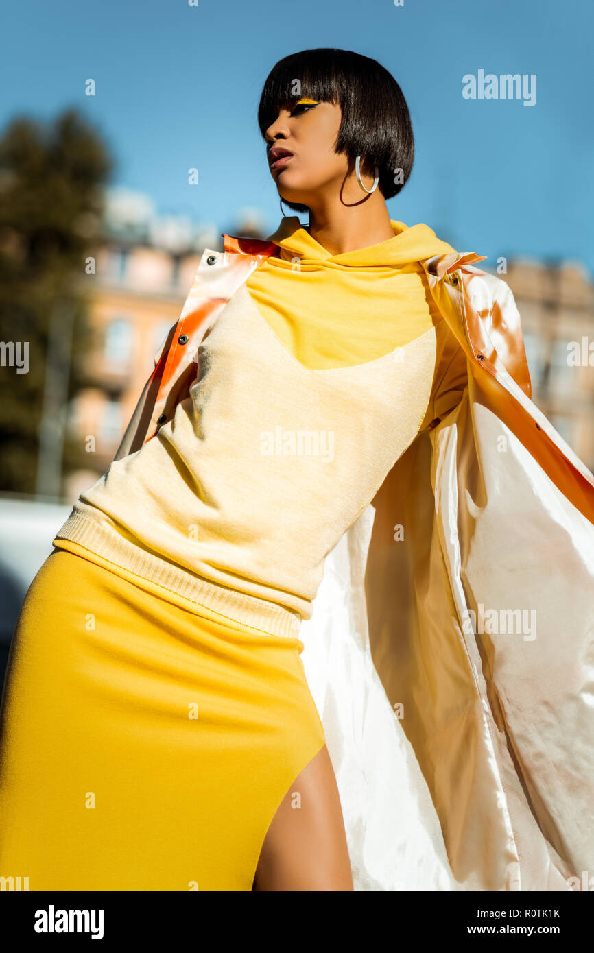Beautiful tanned woman displaying her fit body Stock Photo - Alamy