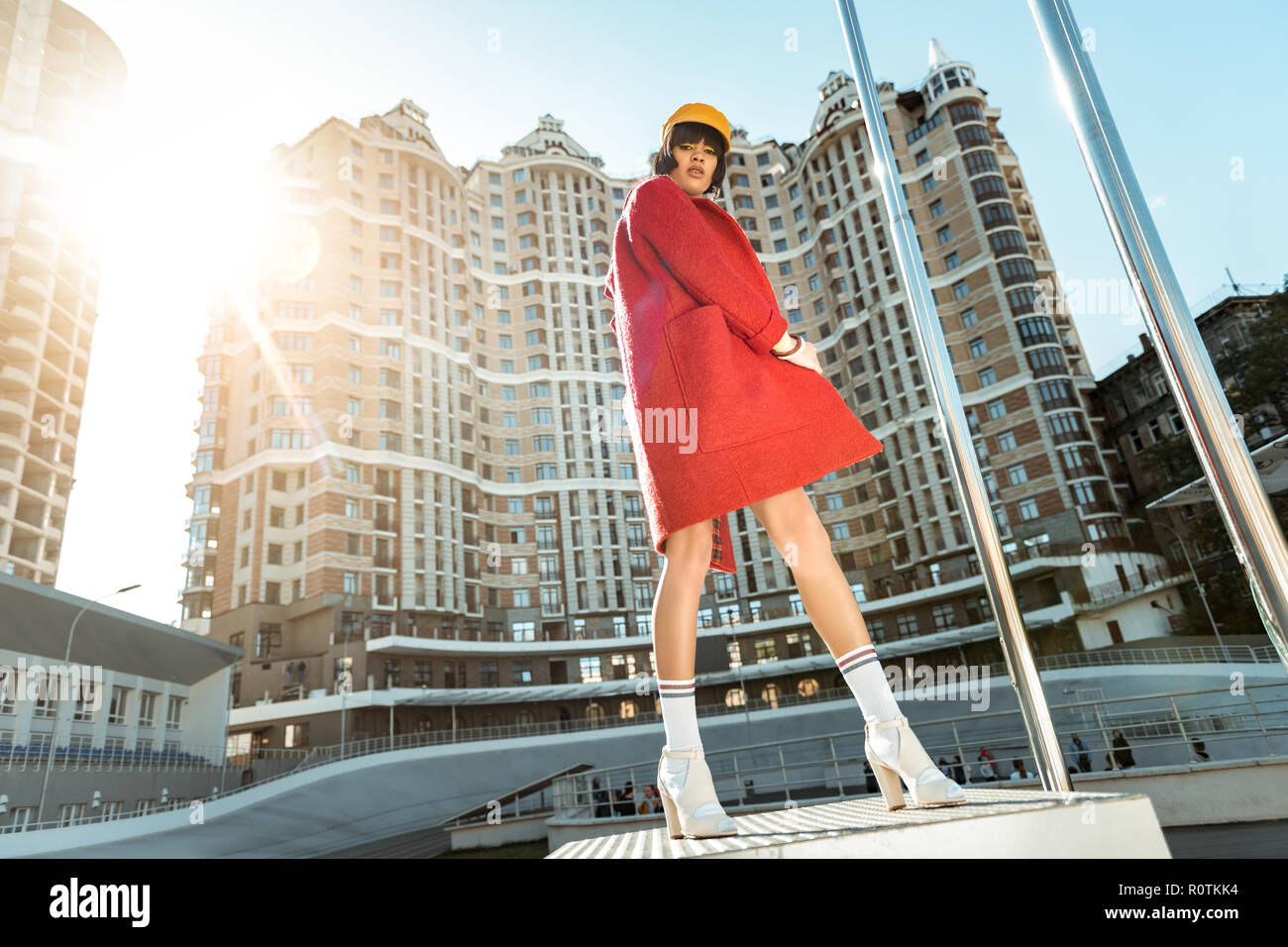 Contemptuous skinny woman wrapping up in her red velvet robe Stock ...