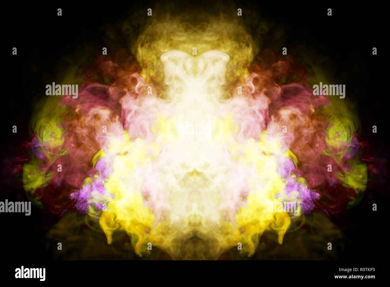 Dense multicolored smoke of pink and yellow colors in the form of a ...