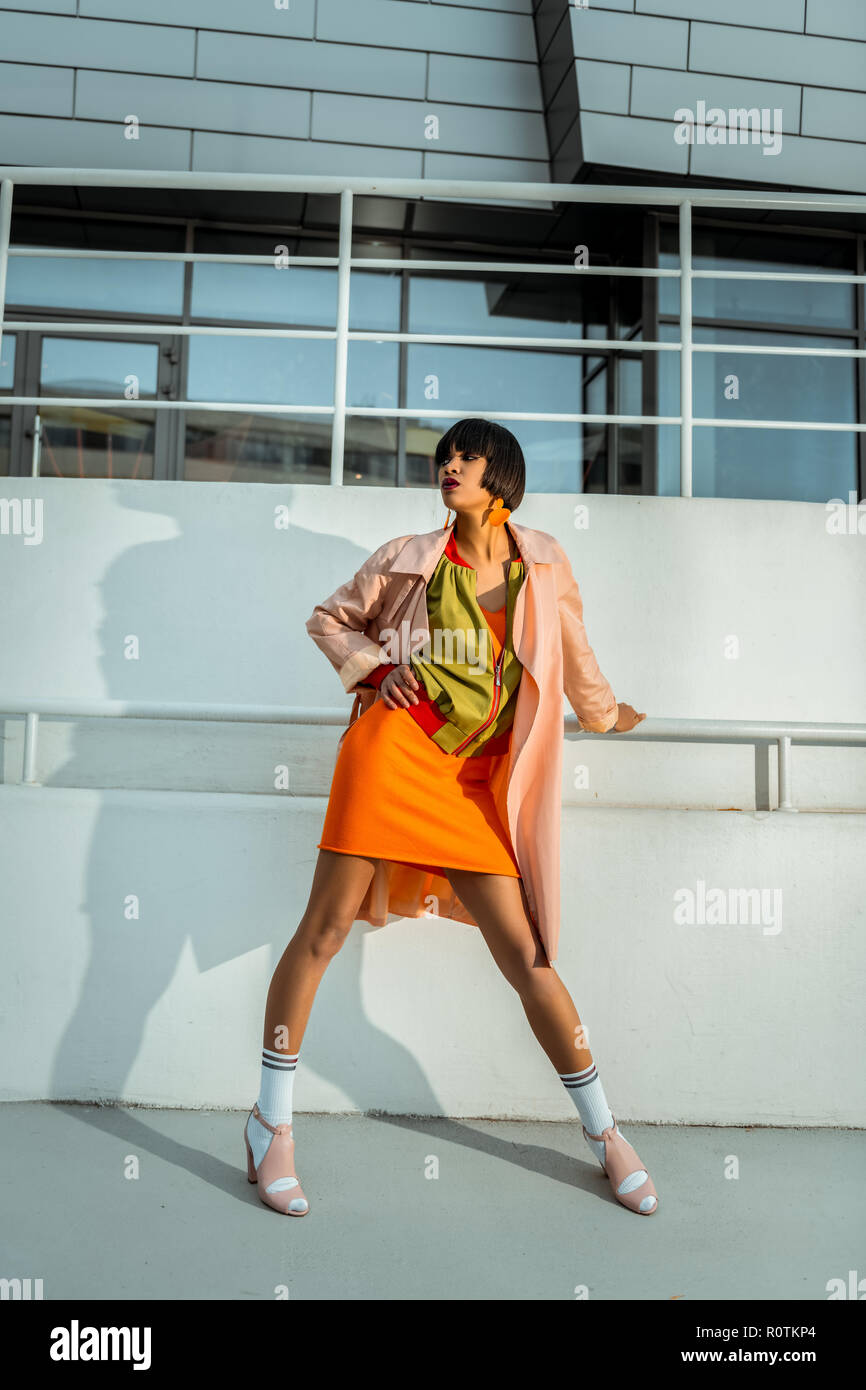 Young appealing lady feeling confident while photoshoot Stock Photo - Alamy