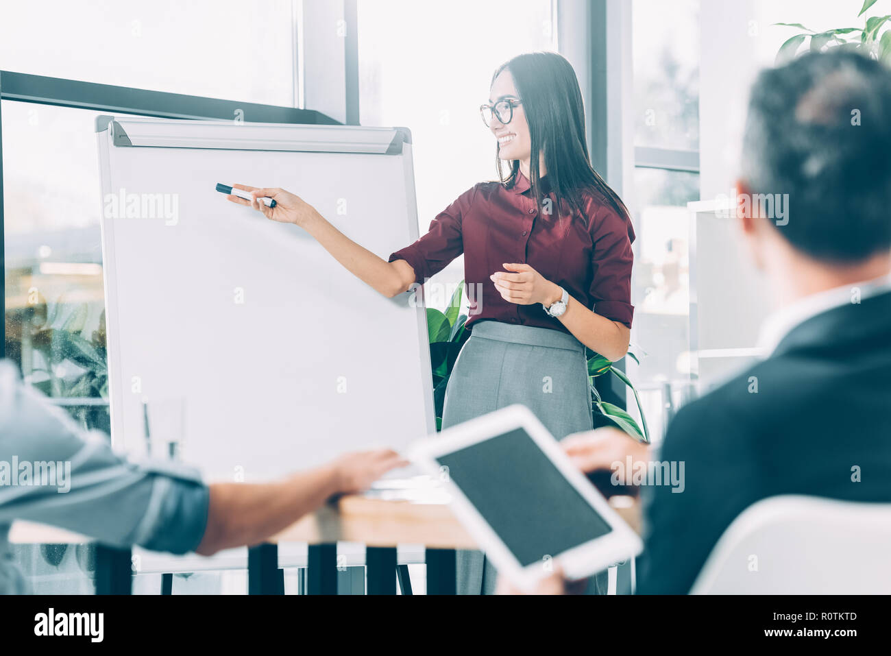 young asian businesswoman giving presentation to colleagues Stock Photo ...