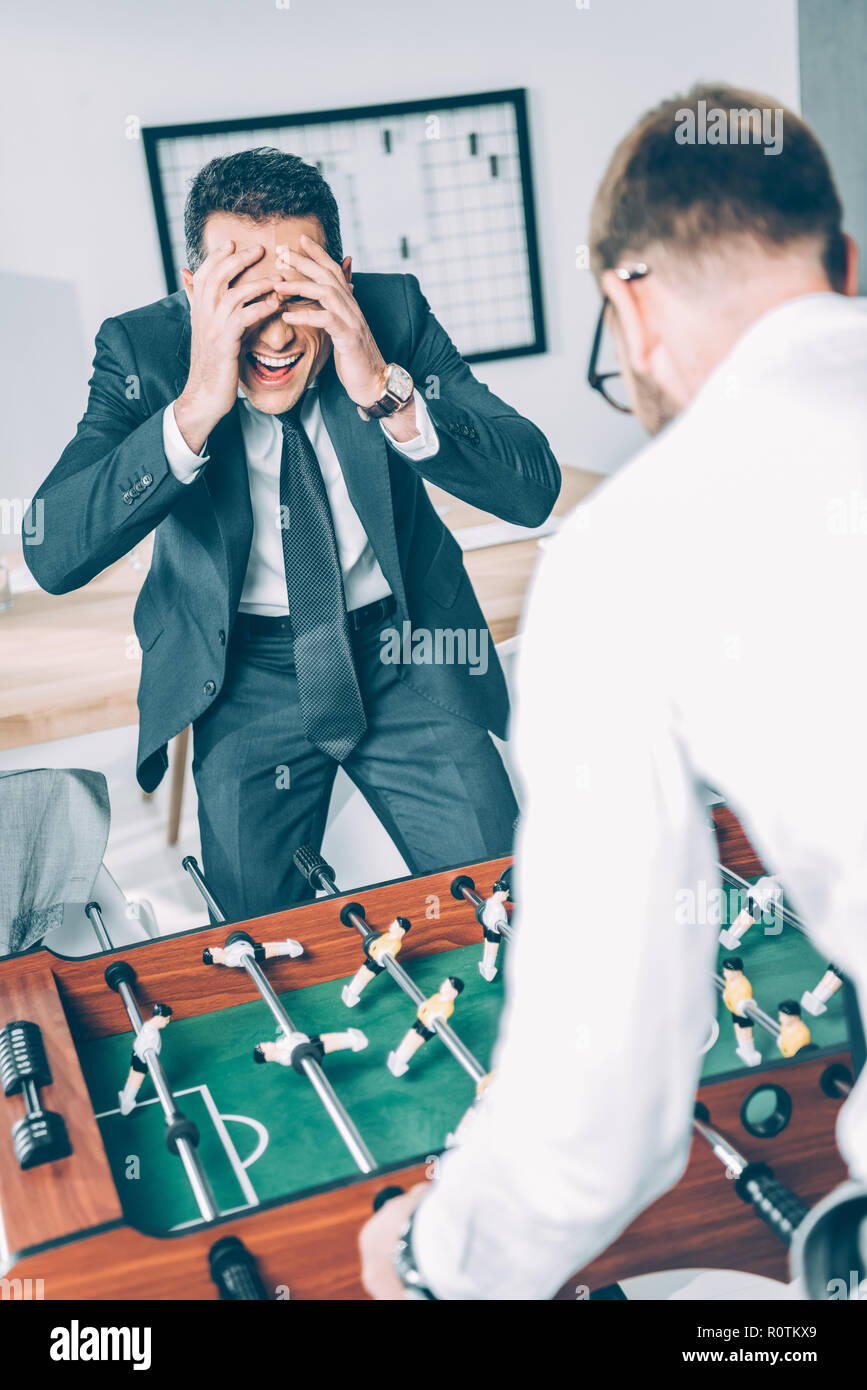 businessmen playing table football in modern office Stock Photo - Alamy