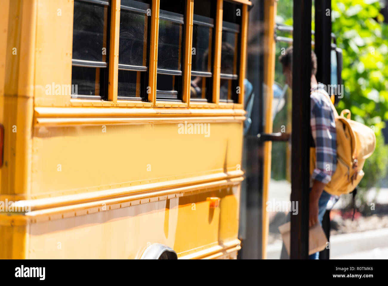 african american schoolboy walking into school bus Stock Photo - Alamy