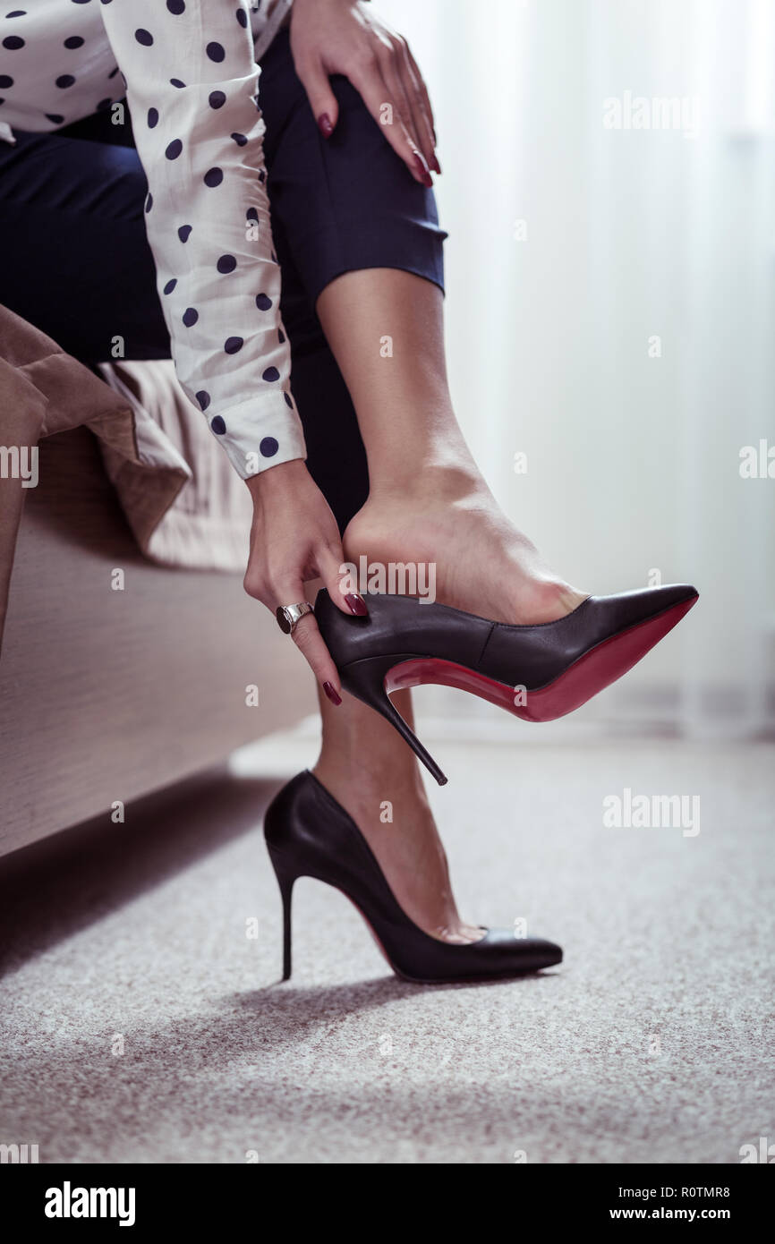 Business woman taking off shoes hi-res stock photography and images - Alamy