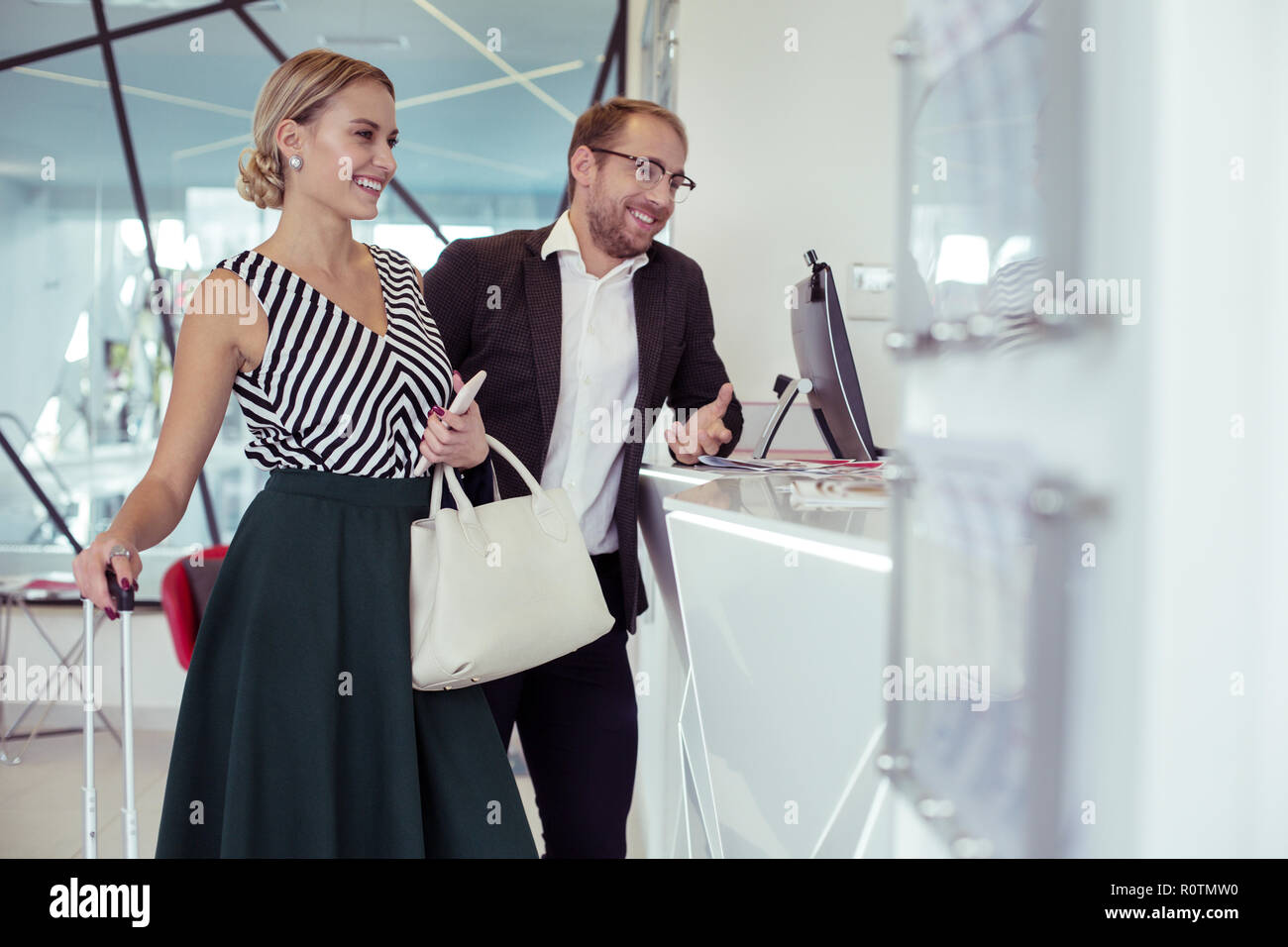 Stylish elegant wife standing near her successful prosperous man Stock ...
