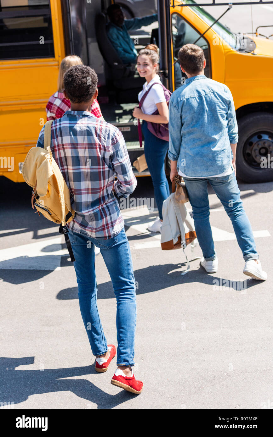 Boy walking to school bus hi-res stock photography and images - Alamy