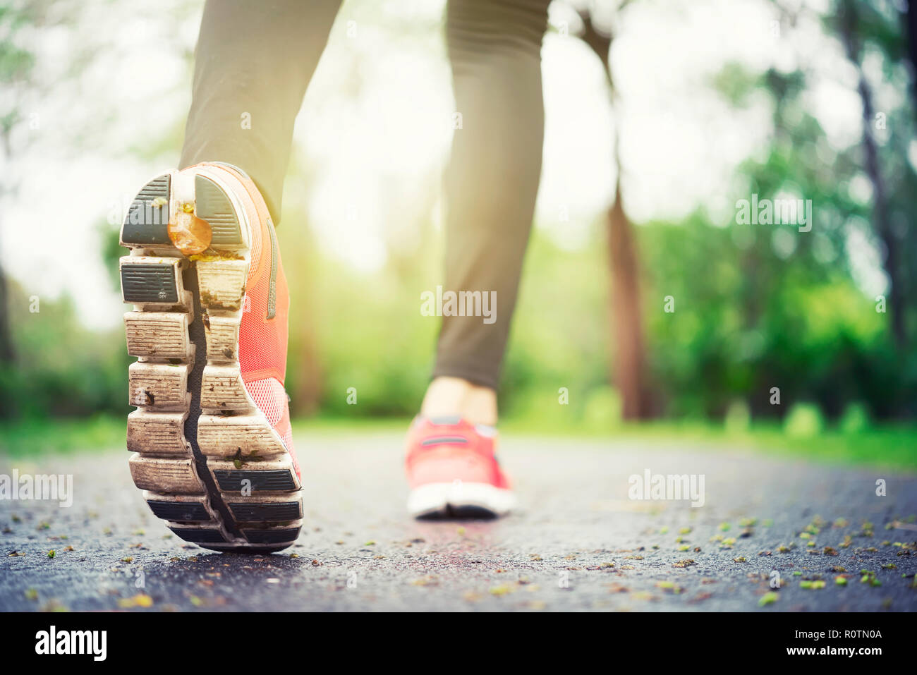 Athlete runner feet running on the road closeup on shoe. Jogger fitness ...