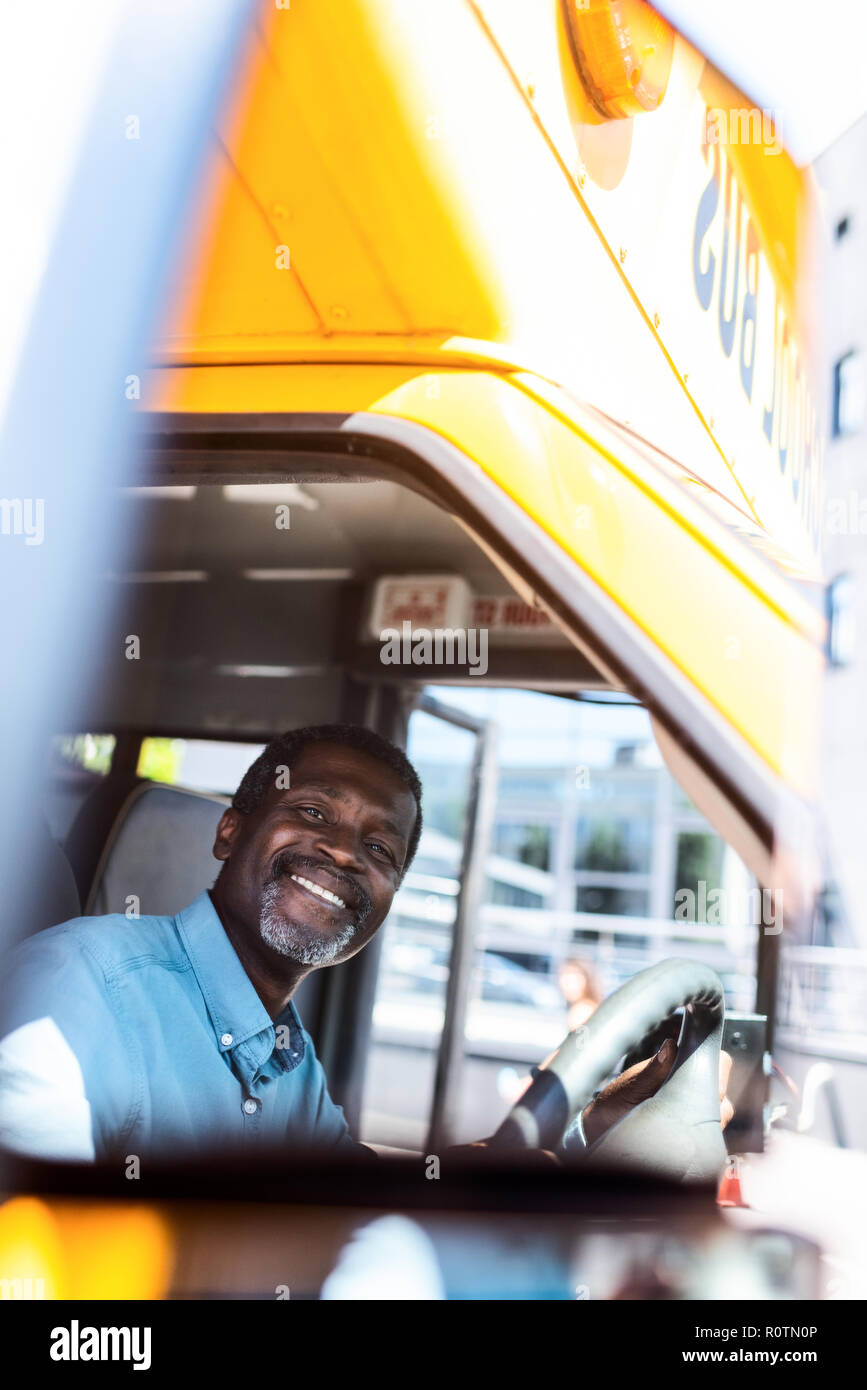 happy mature african american bus driver looking at camera Stock Photo ...