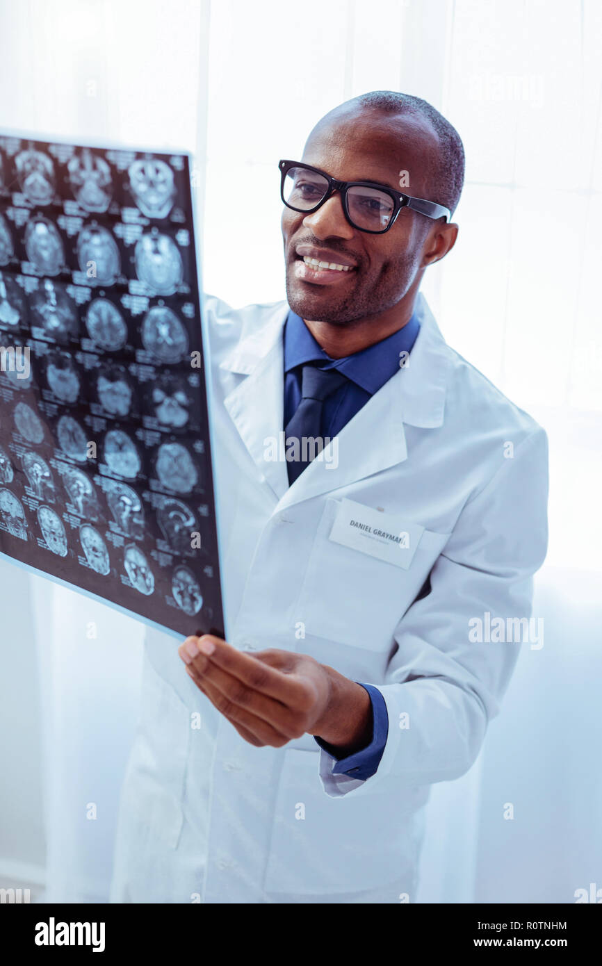 Cheerful positive smart man being at work Stock Photo - Alamy