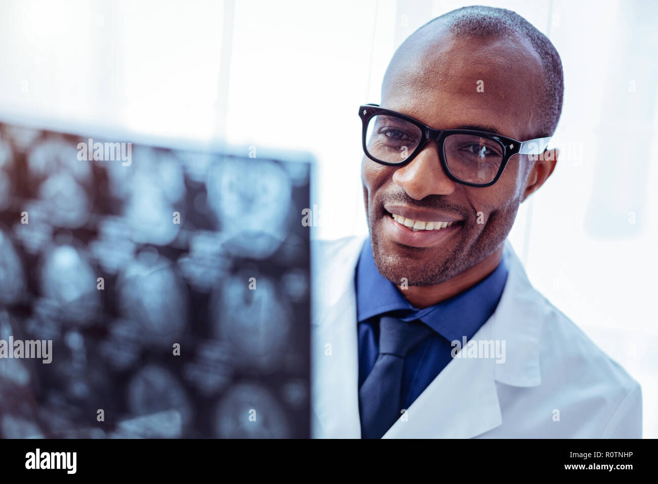 Portrait of a nice professional male doctor Stock Photo - Alamy