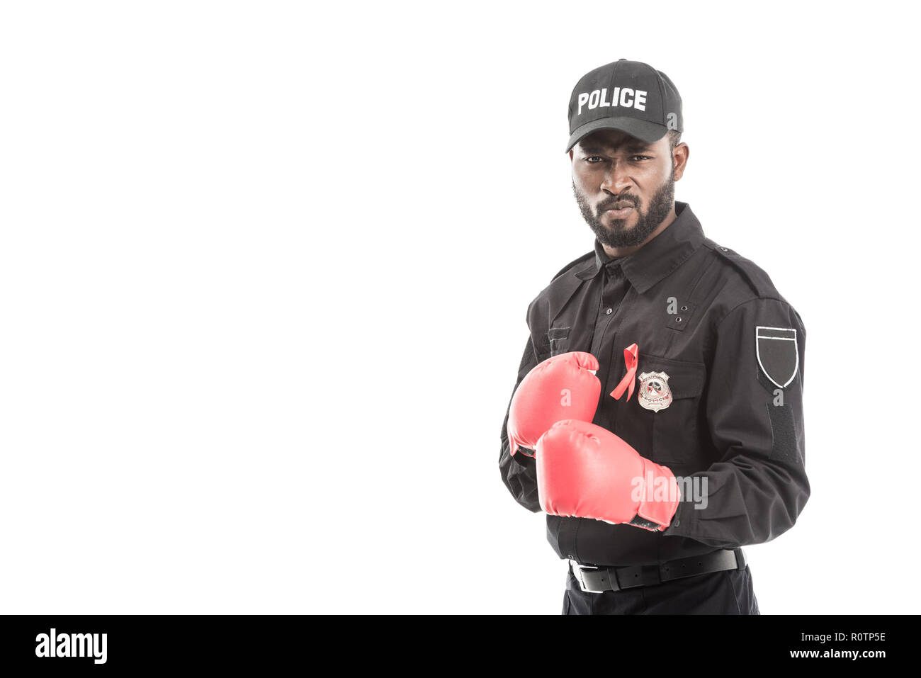 serious african american police officer with boxing gloves isolated on ...