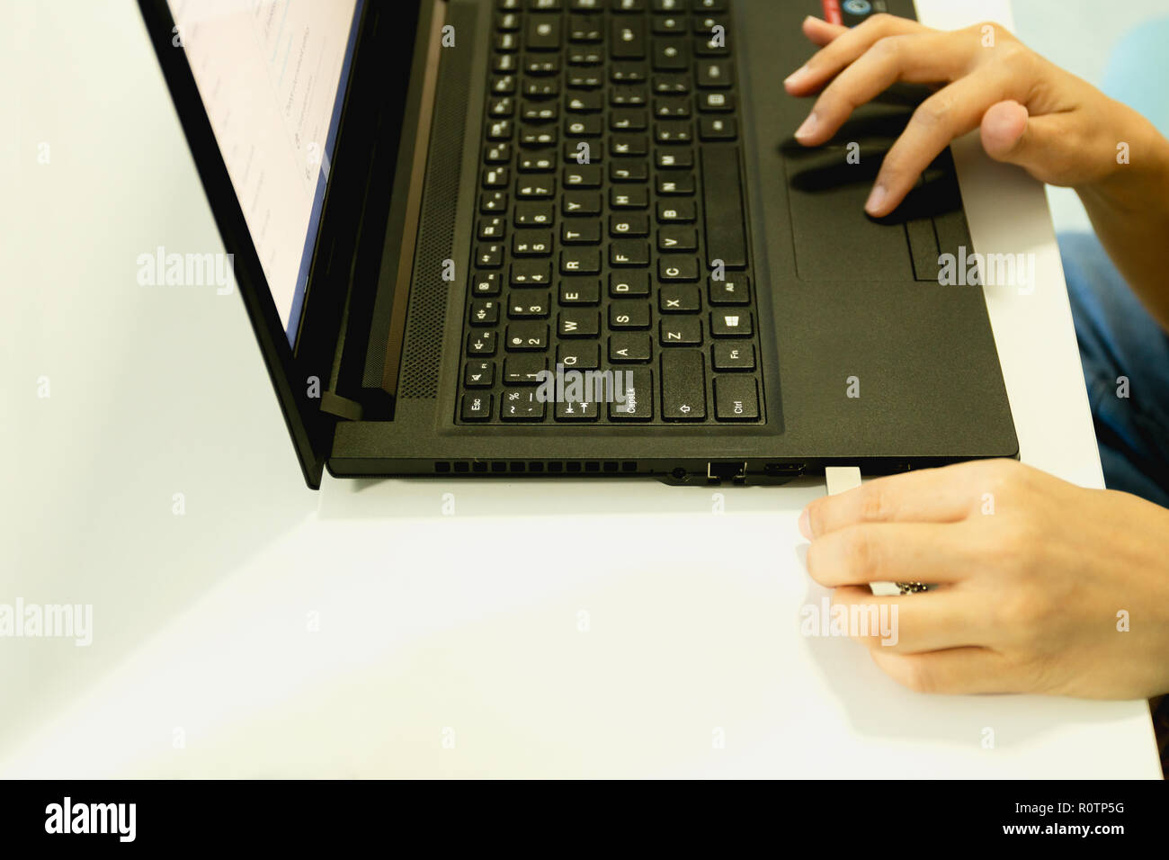 Woman plugging computer hi-res stock photography and images - Alamy