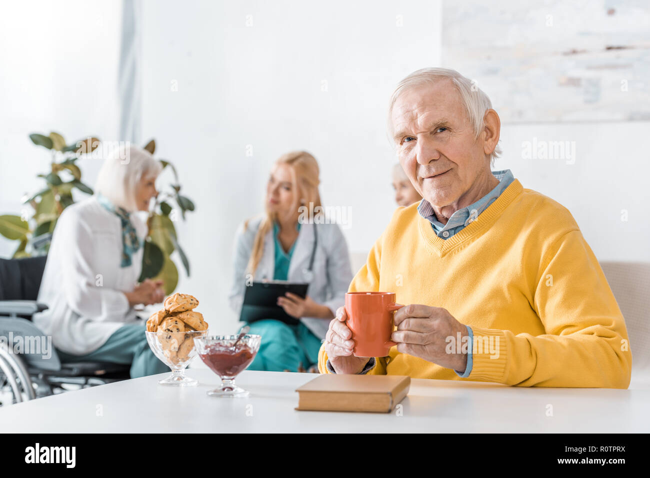 Senior man drinking tea hi-res stock photography and images - Alamy