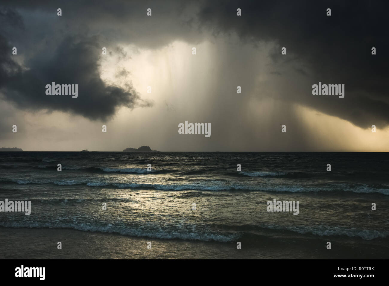 Dramatic seascape with storm and rain and dark clouds Stock Photo - Alamy