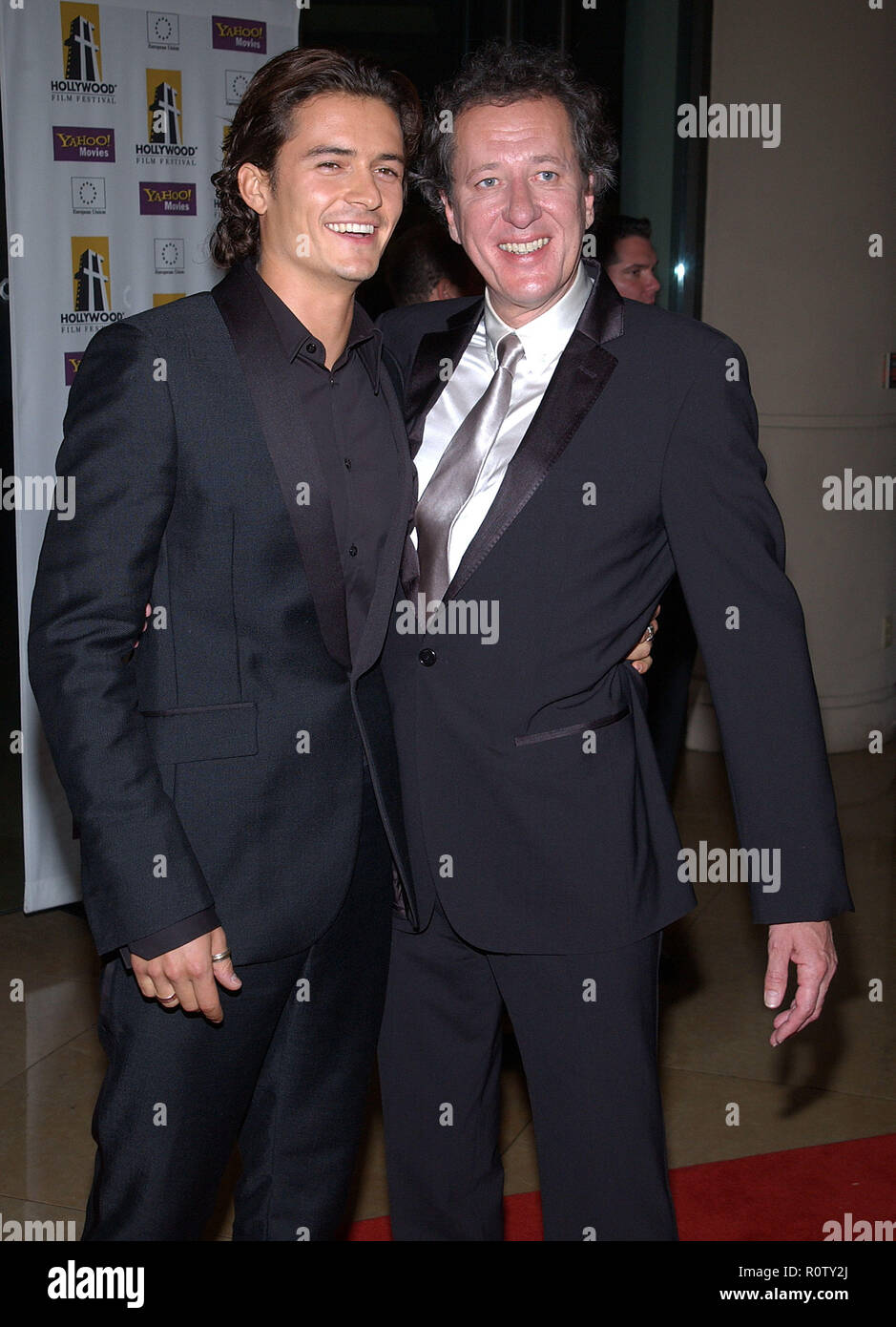 Orlando Bloom and Geoffrey Rush posing at the " HOLLYWOOD AWARDS GALA ...