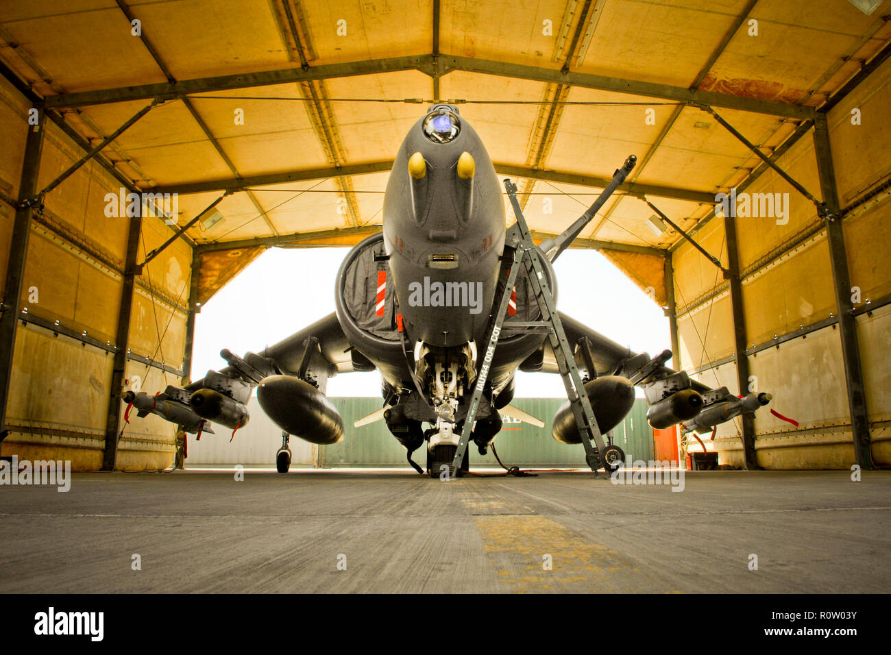 HARRIER of RAF No 1 (F) Squadron aircraft waits in a hangar at Kandahar ...