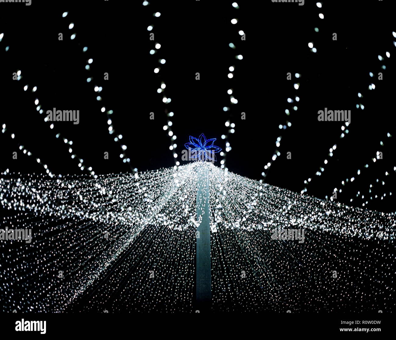 Christmas street light strings at night against black Stock Photo - Alamy