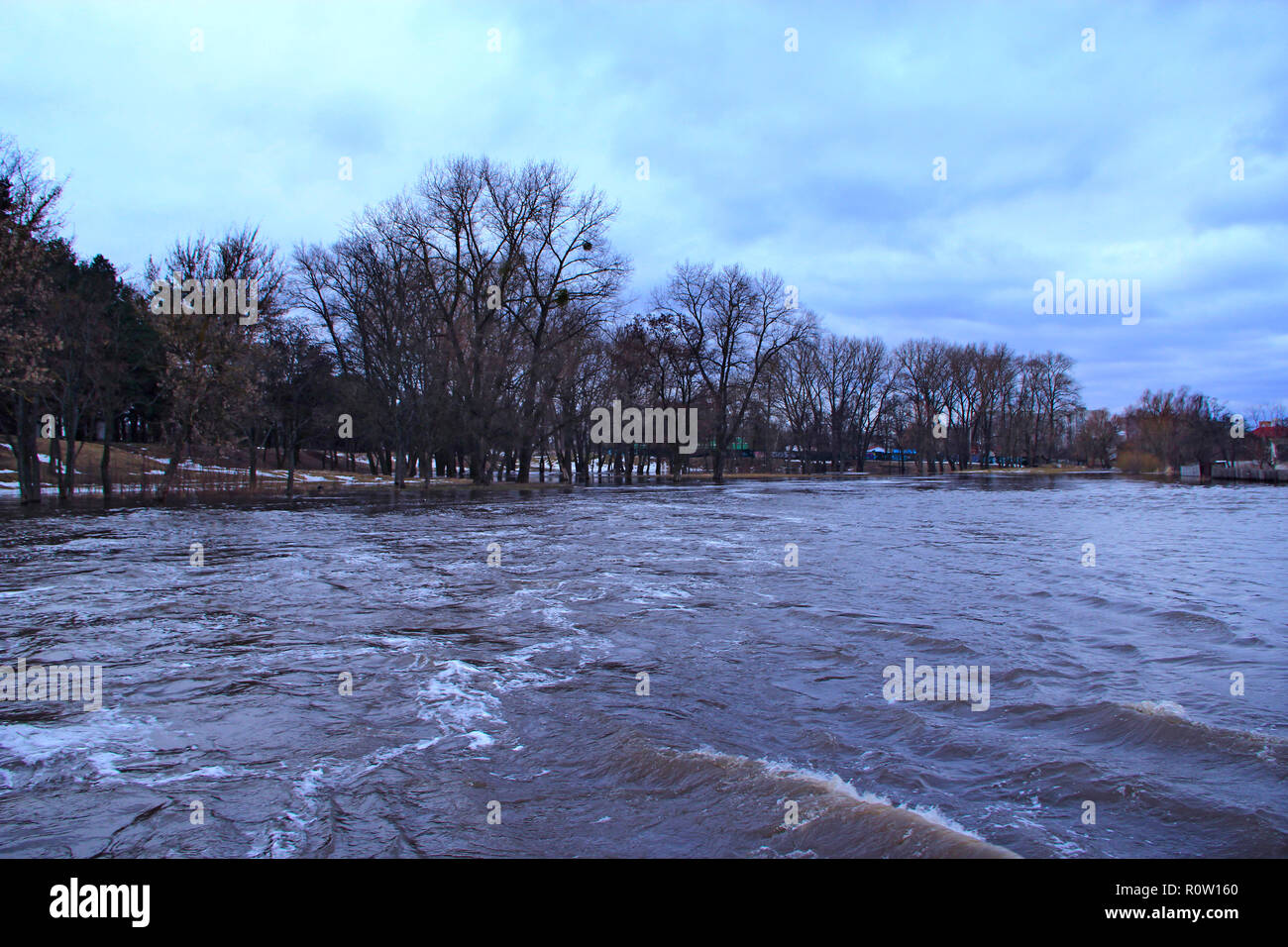 Flooding of river in spring in town during melting of snow. Flooding ...