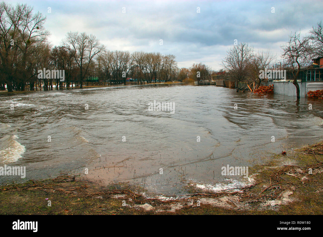 Flooding of river in spring in town during melting of snow. Flooding ...