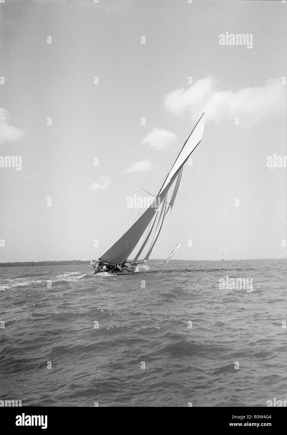Unknown gaff rigged cutter beating upwind, 1911. Creator: Kirk & Sons ...