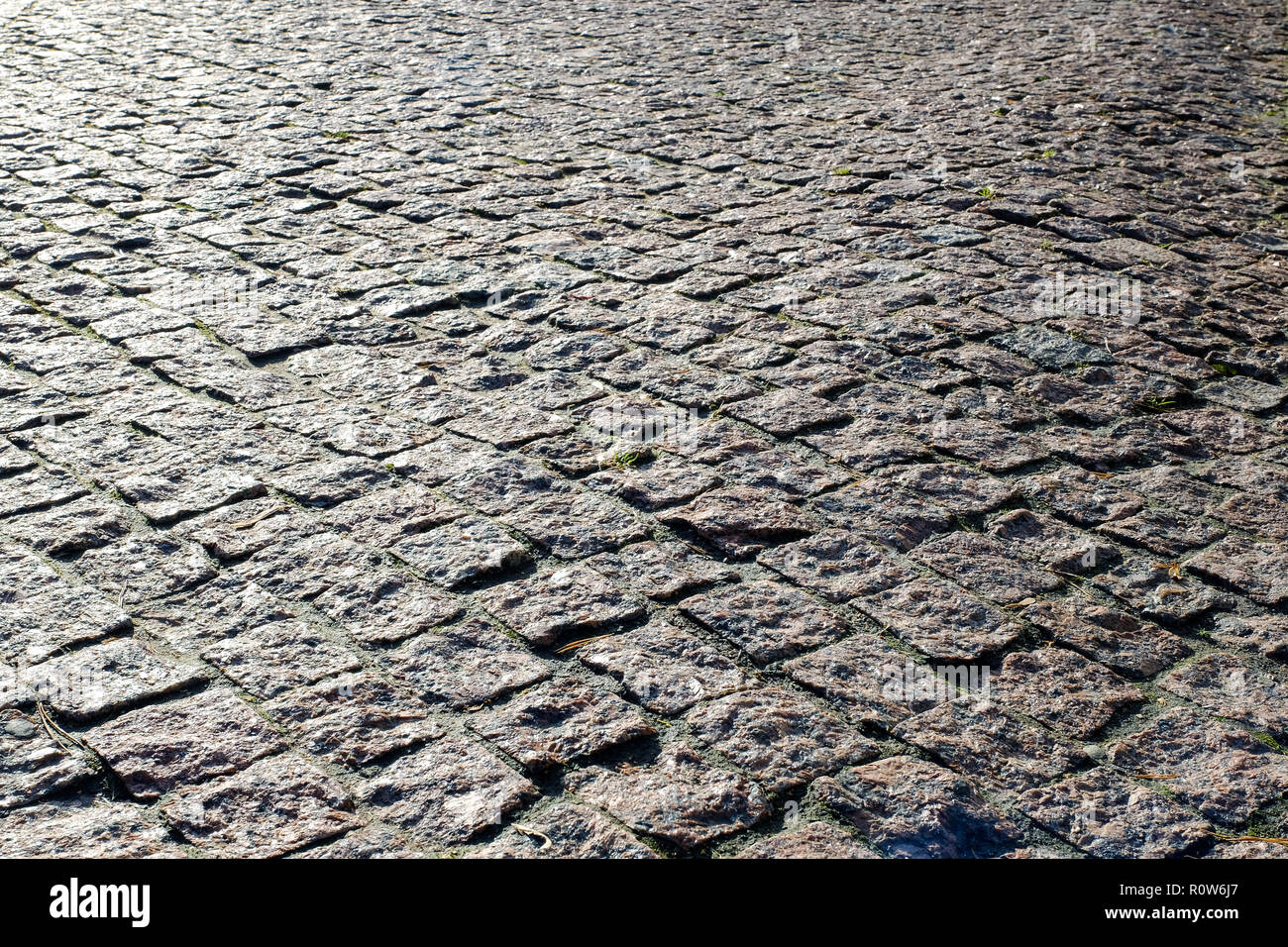 Ancient granite paving. Close-up view from above. Pavement Stock Photo ...