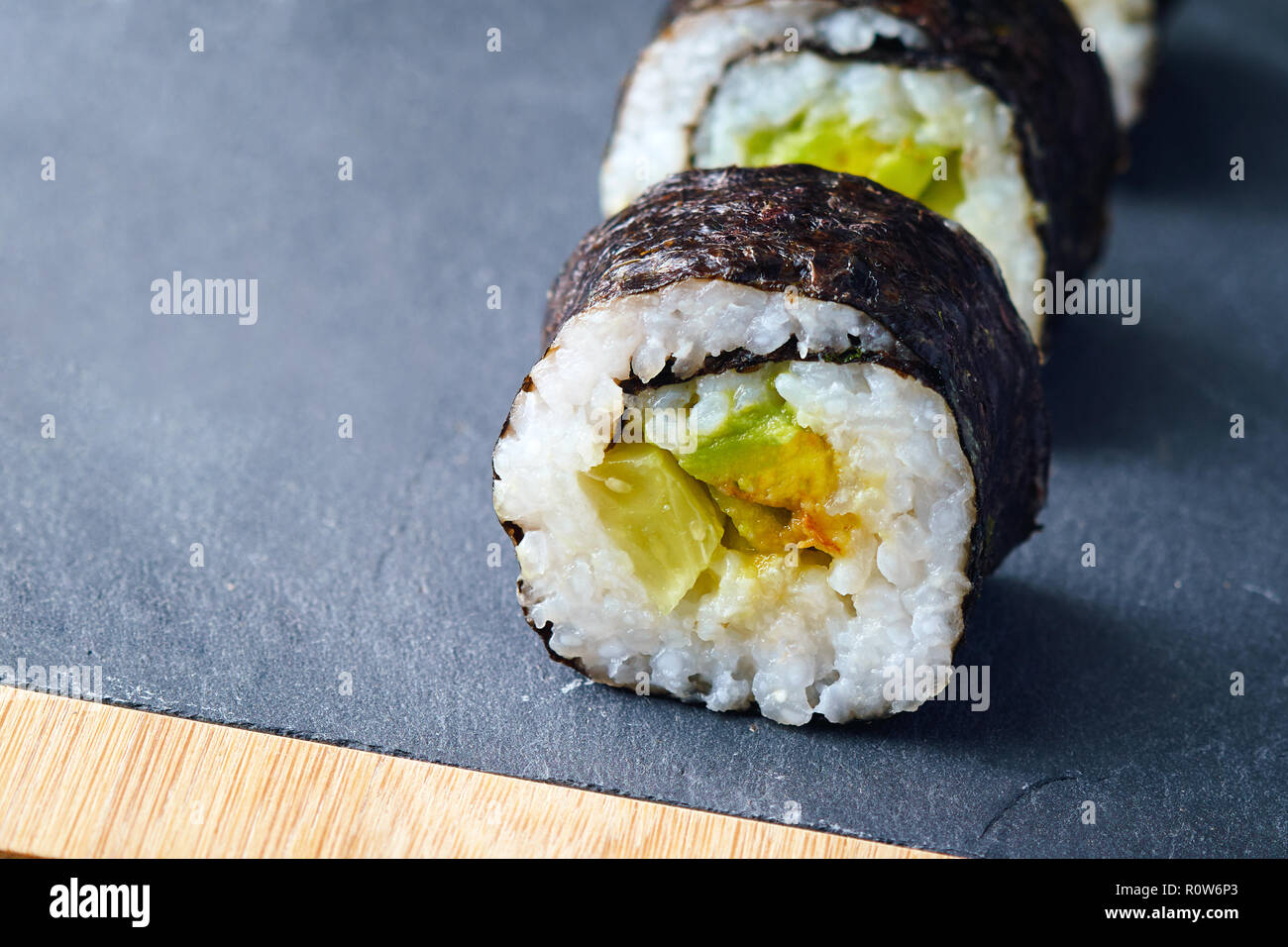 Vegan sushi rolls made with nori algae, sushi rice, cucumbers and avocado Stock Photo - Alamy