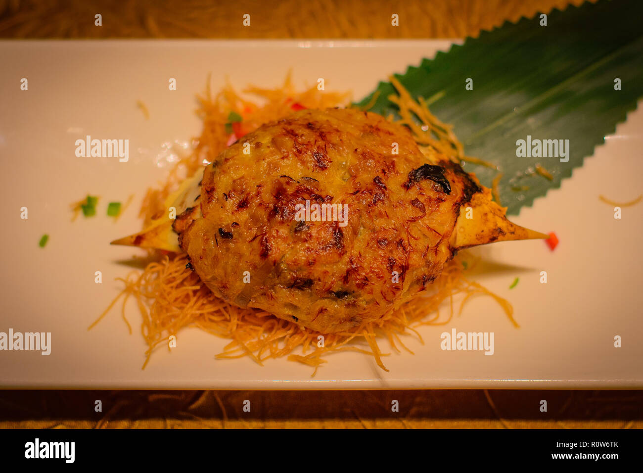 Baked crab shell stuffed with crab meat and black truffle paste Stock ...