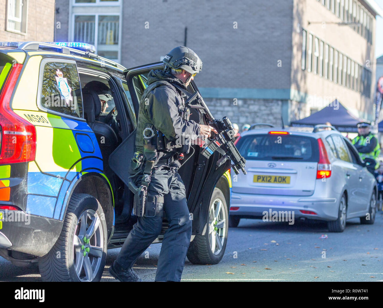 Armed Firearms Police officers demonstrating a vehicle stop and arrest ...