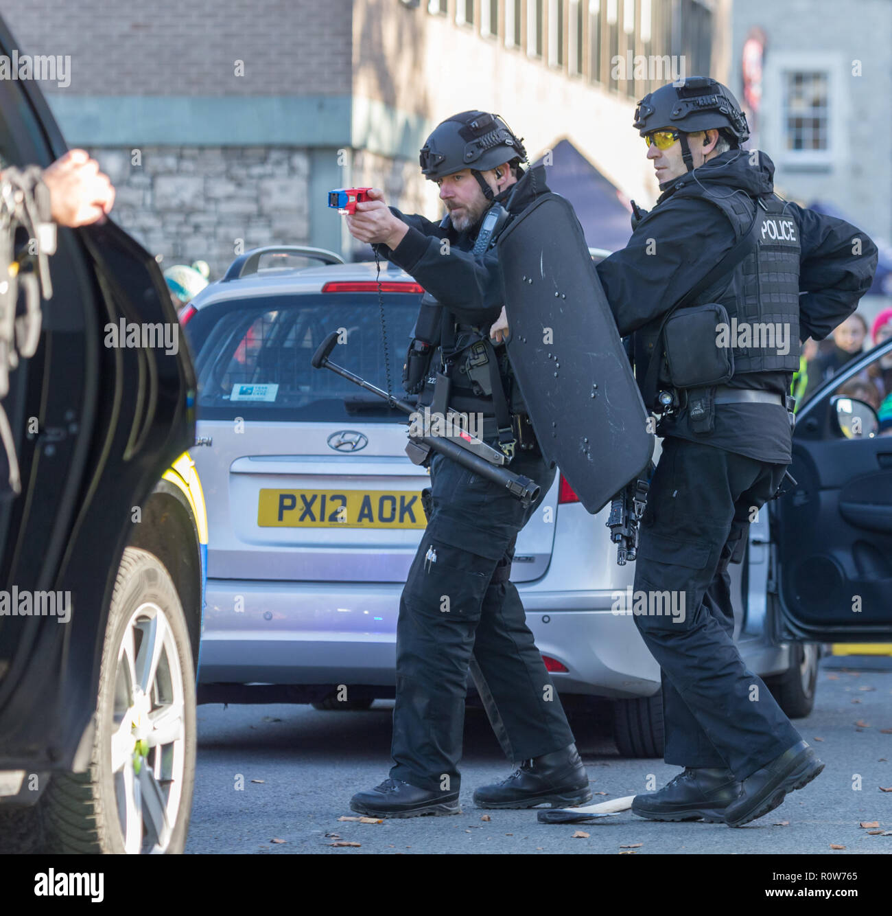 Armed Firearms Police officers demonstrating a vehicle stop and arrest ...
