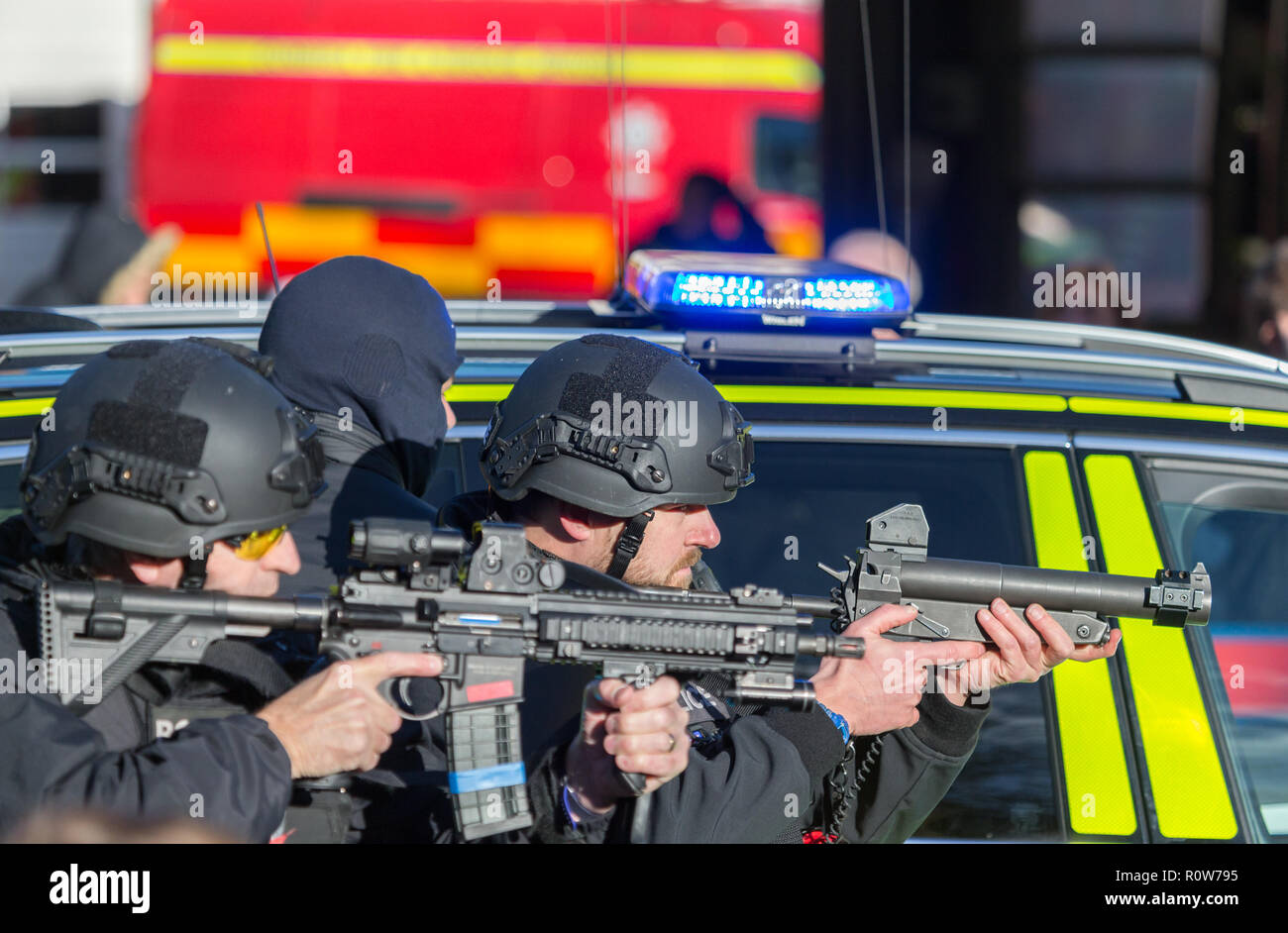 Armed Firearms Police officers demonstrating a vehicle stop and arrest ...
