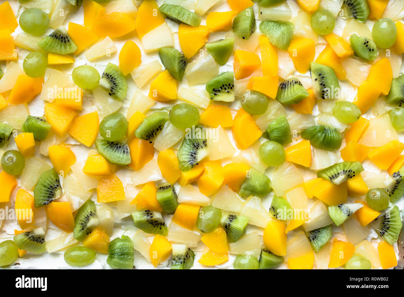 Colorful fruits texture from fruit slices - kiwi, pineapple, grapes ...