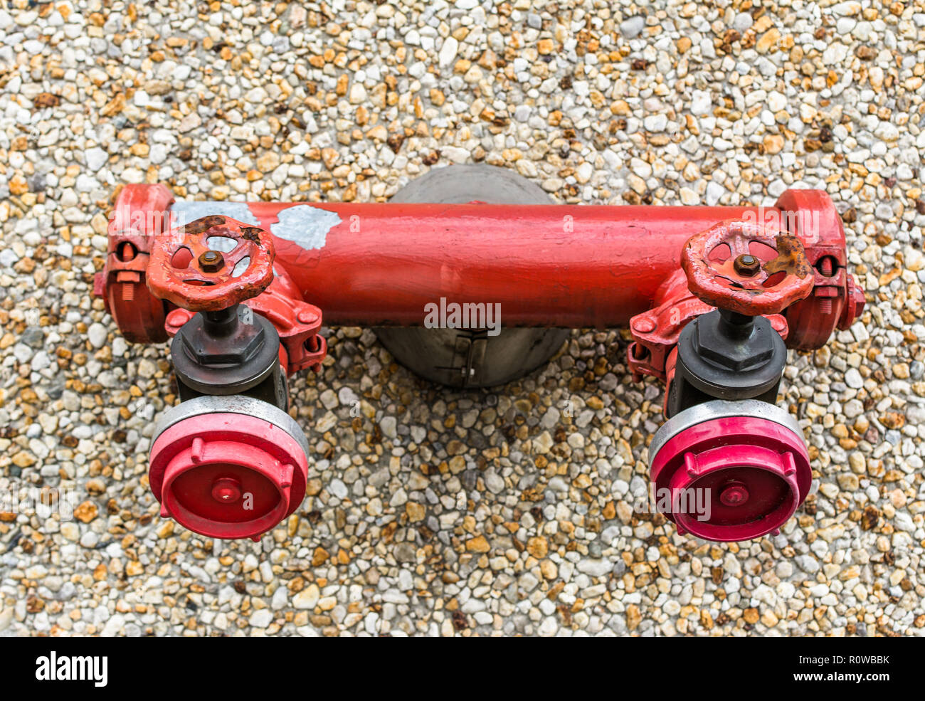 Industrial fire hydrant in a stone wall, standpipe or fireplug Stock ...