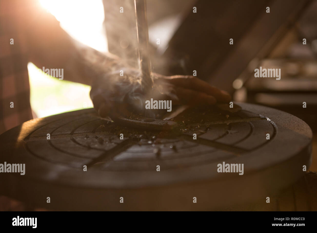 Female metalsmith using radial drilling machine in factory Stock Photo ...