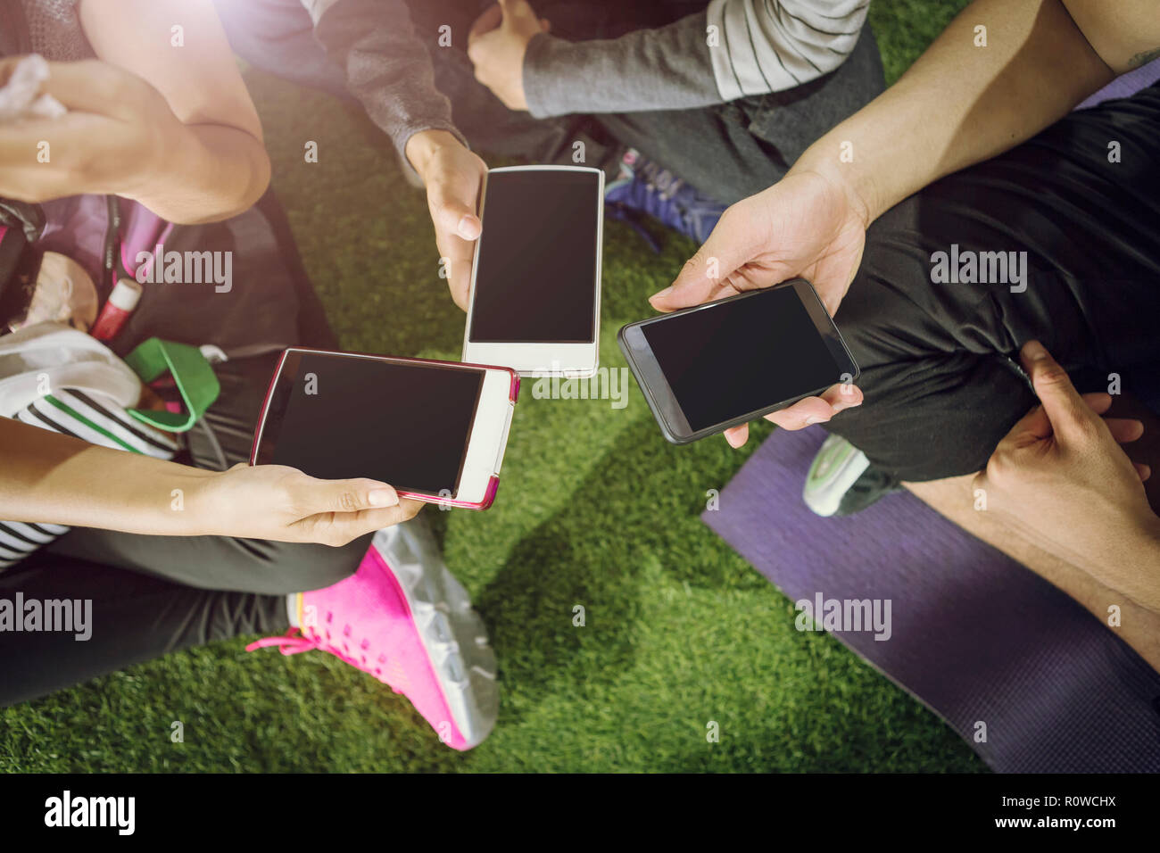 Group of people using smartphones together. Connection technology ...