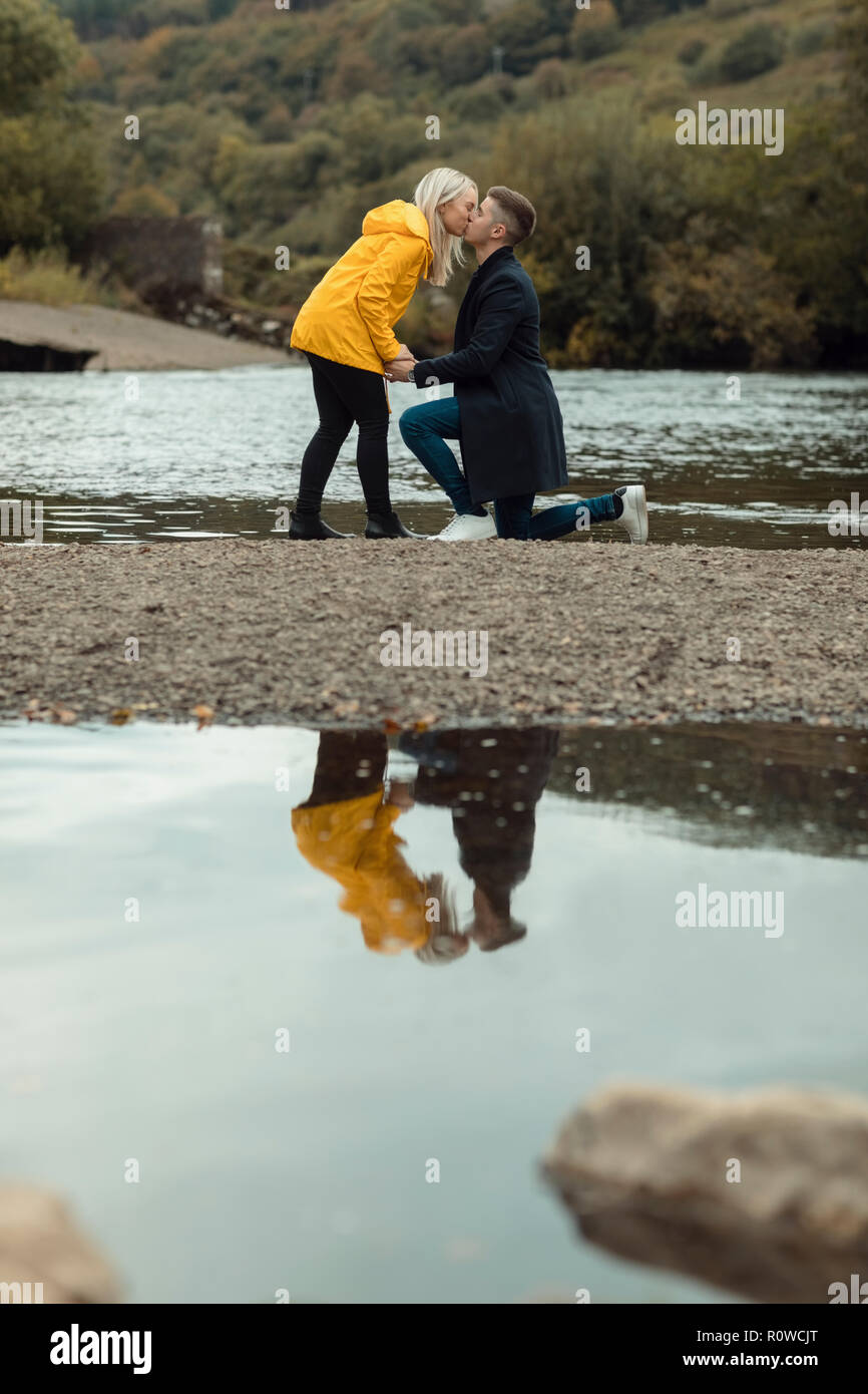 Romantic couple kissing near river Stock Photo - Alamy
