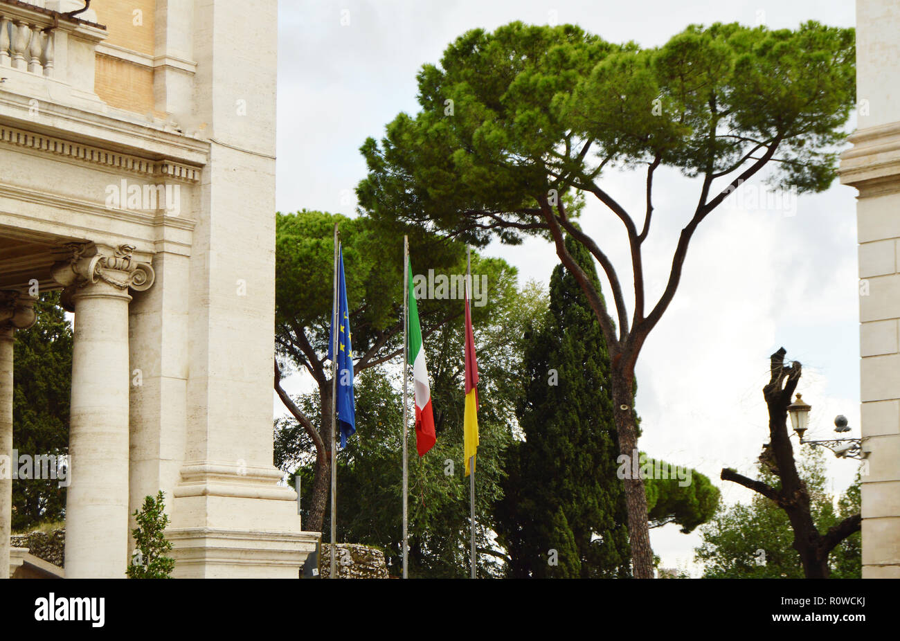 The national flag of Italy, the European Union EU flag of the city of ...