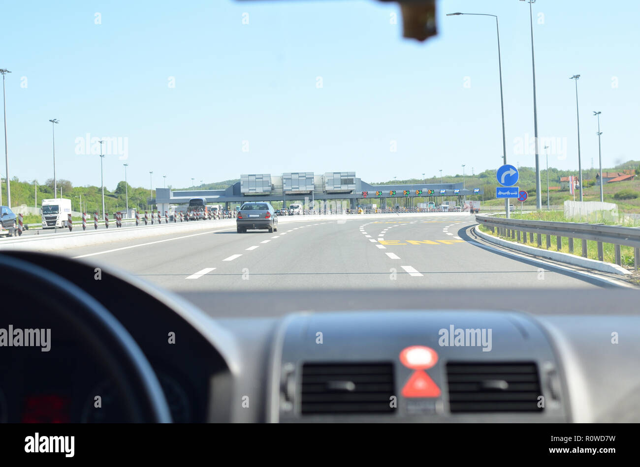 Driving a car on a highway and approaching to a pay toll Stock Photo ...
