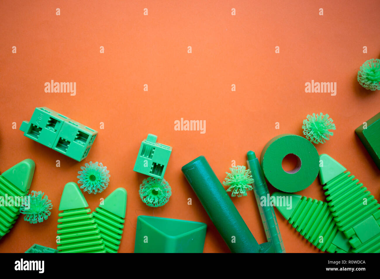 Kids toys background in green colours, colorful assorted Stock Photo ...