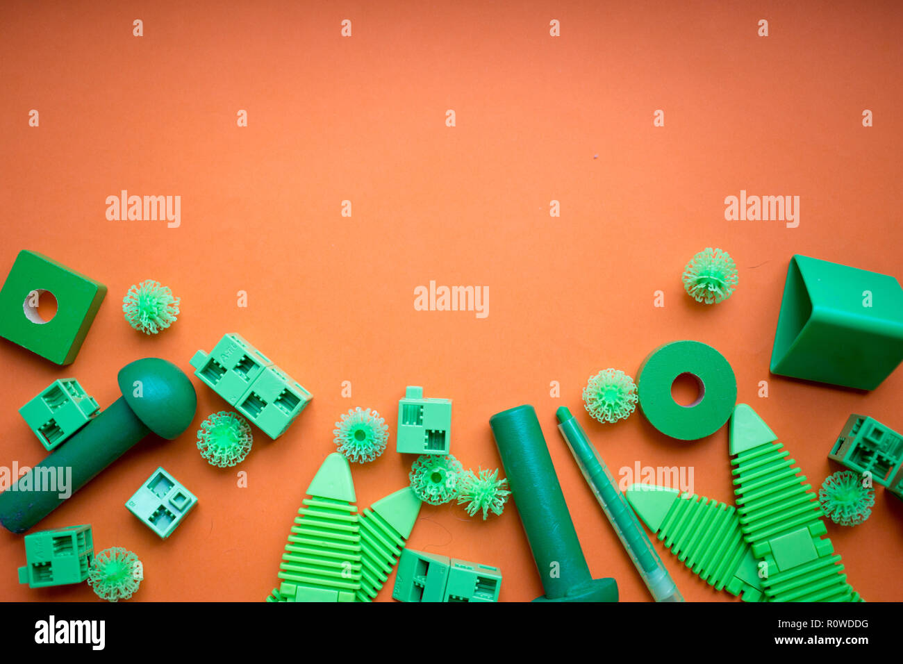 Kids toys background in green colours, colorful assorted Stock Photo ...