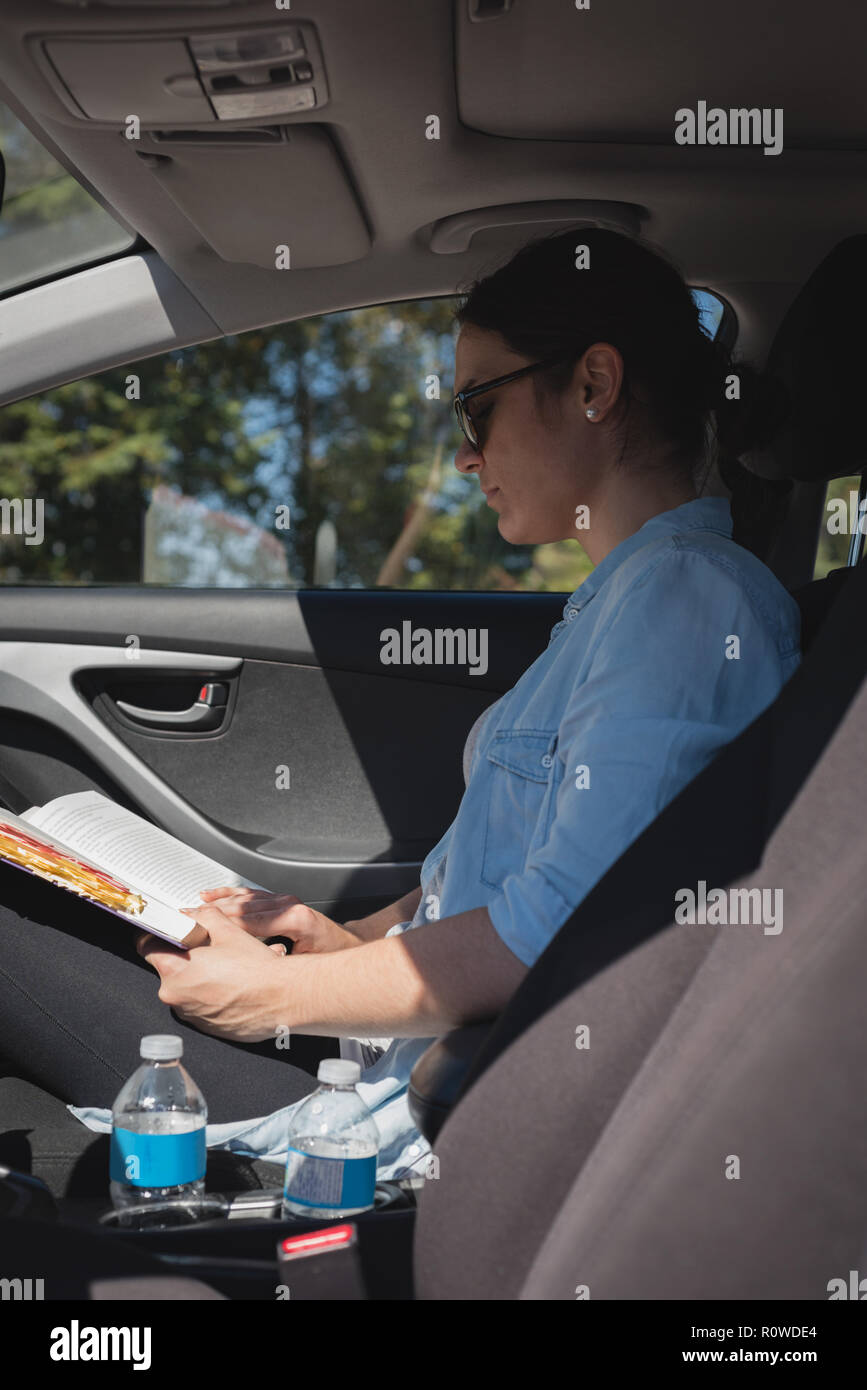 Reading in a car hi-res stock photography and images - Alamy